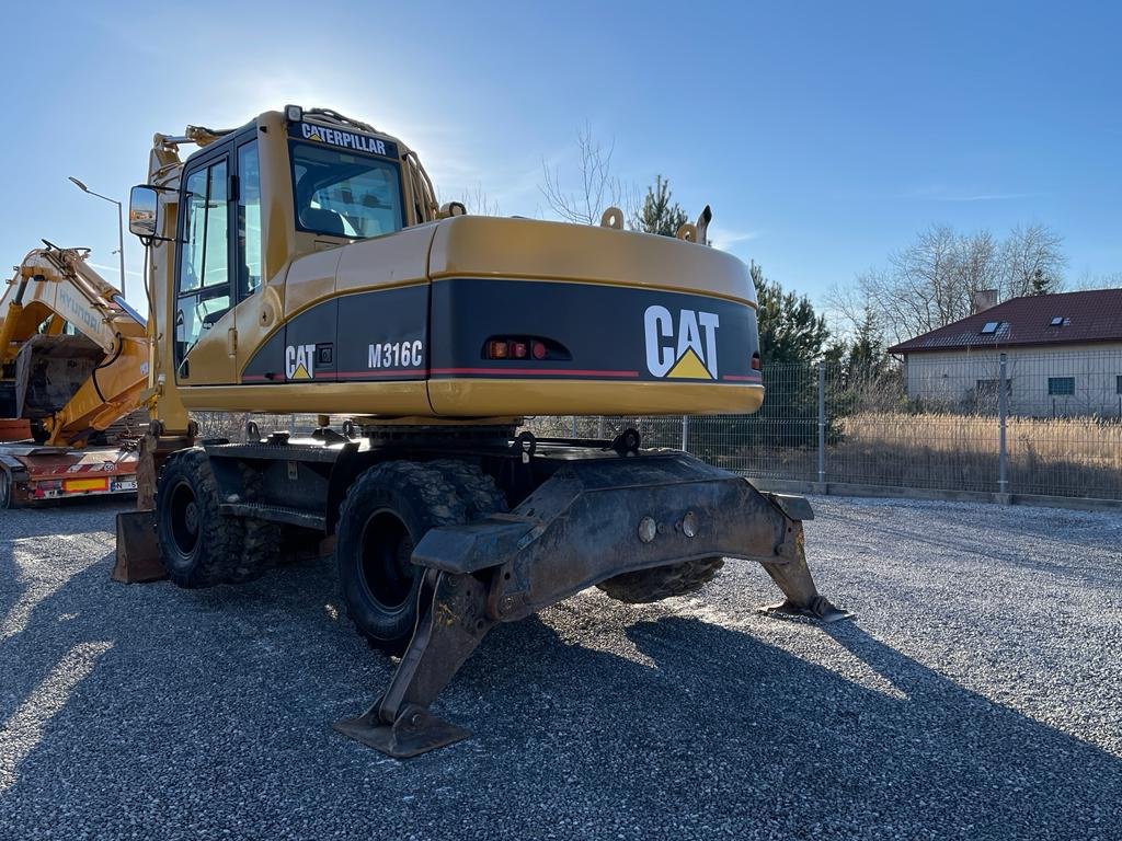 Dawid Gwóźdź - Maszyny budowlane - CATERPILLAR M316C