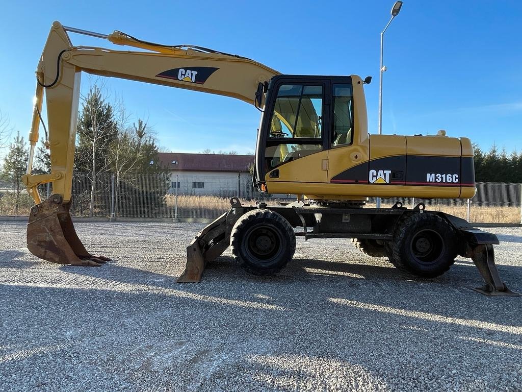 Dawid Gwóźdź - Maszyny budowlane - CATERPILLAR M316C